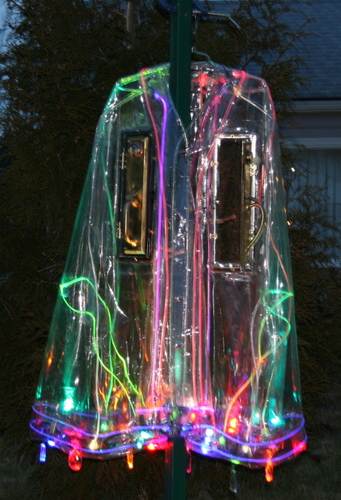 Closeup Of Clear Plastic Rain Cape Being Worn By No Parking Sign On E ...